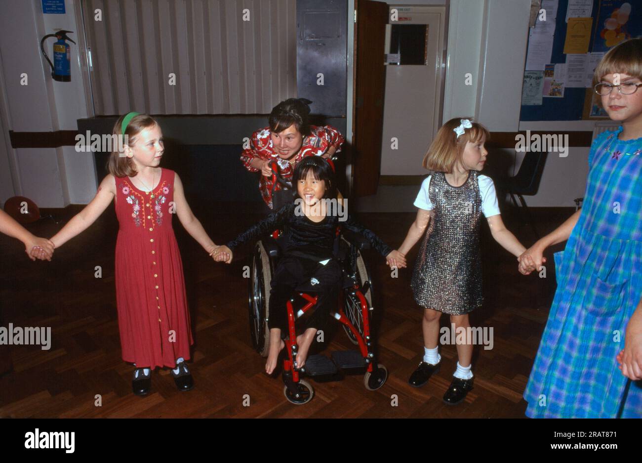 Asian Child in Wheelchair Dancing at 8 year Old Birthday Party England ...