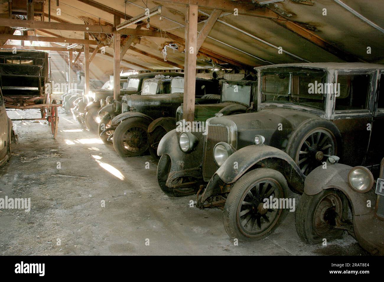 A dusty old barn reveals a treasure trove of vintage cars Stock Photo ...