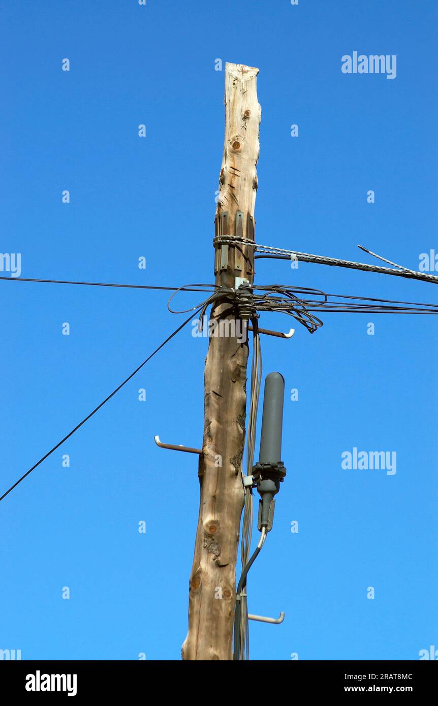 wooden post used to support part of the wiring Stock Photo - Alamy