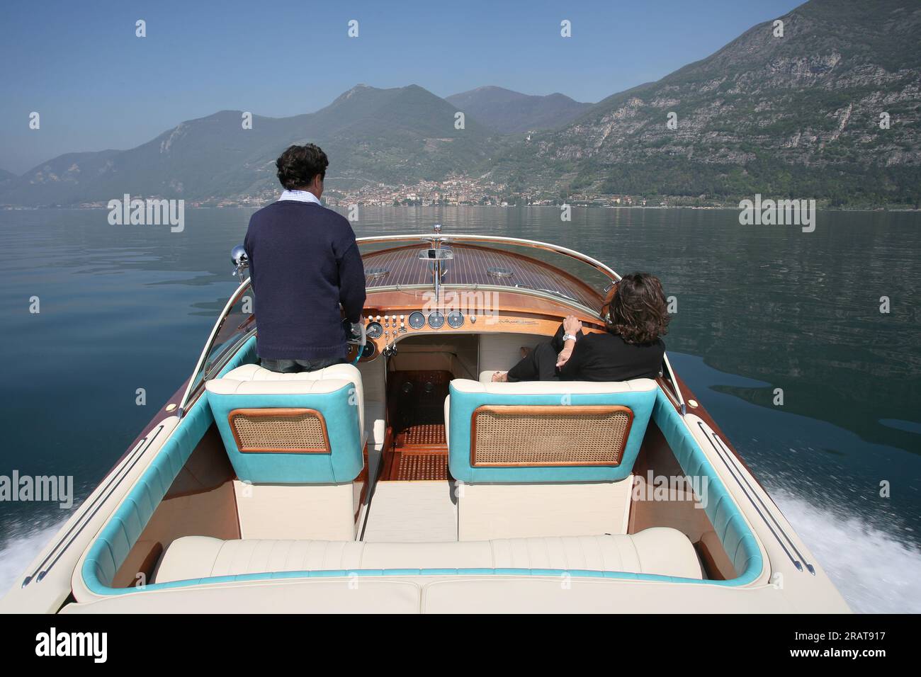 A classic Riva speed boat dashes across an Italian lake Stock Photo - Alamy