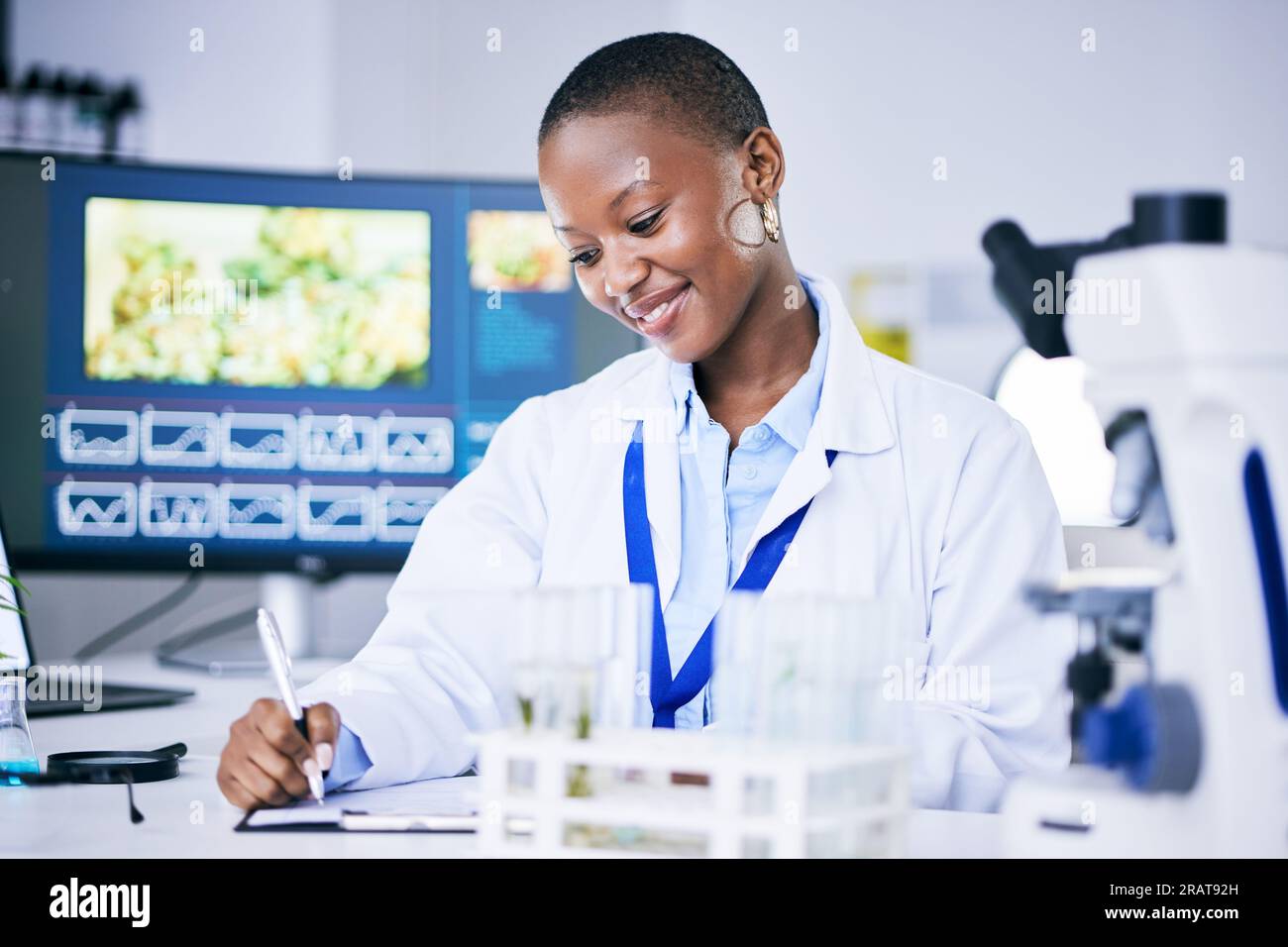 Writing, biotechnology and scientist woman in laboratory research ...