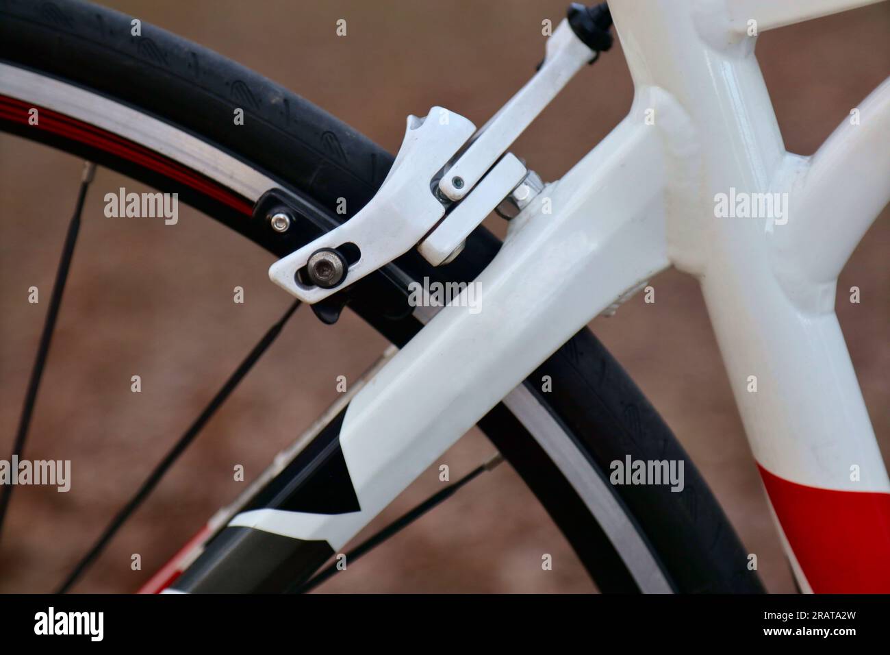 bicycle frame detail with rear brake caliper, rear wheel, spokes and ...