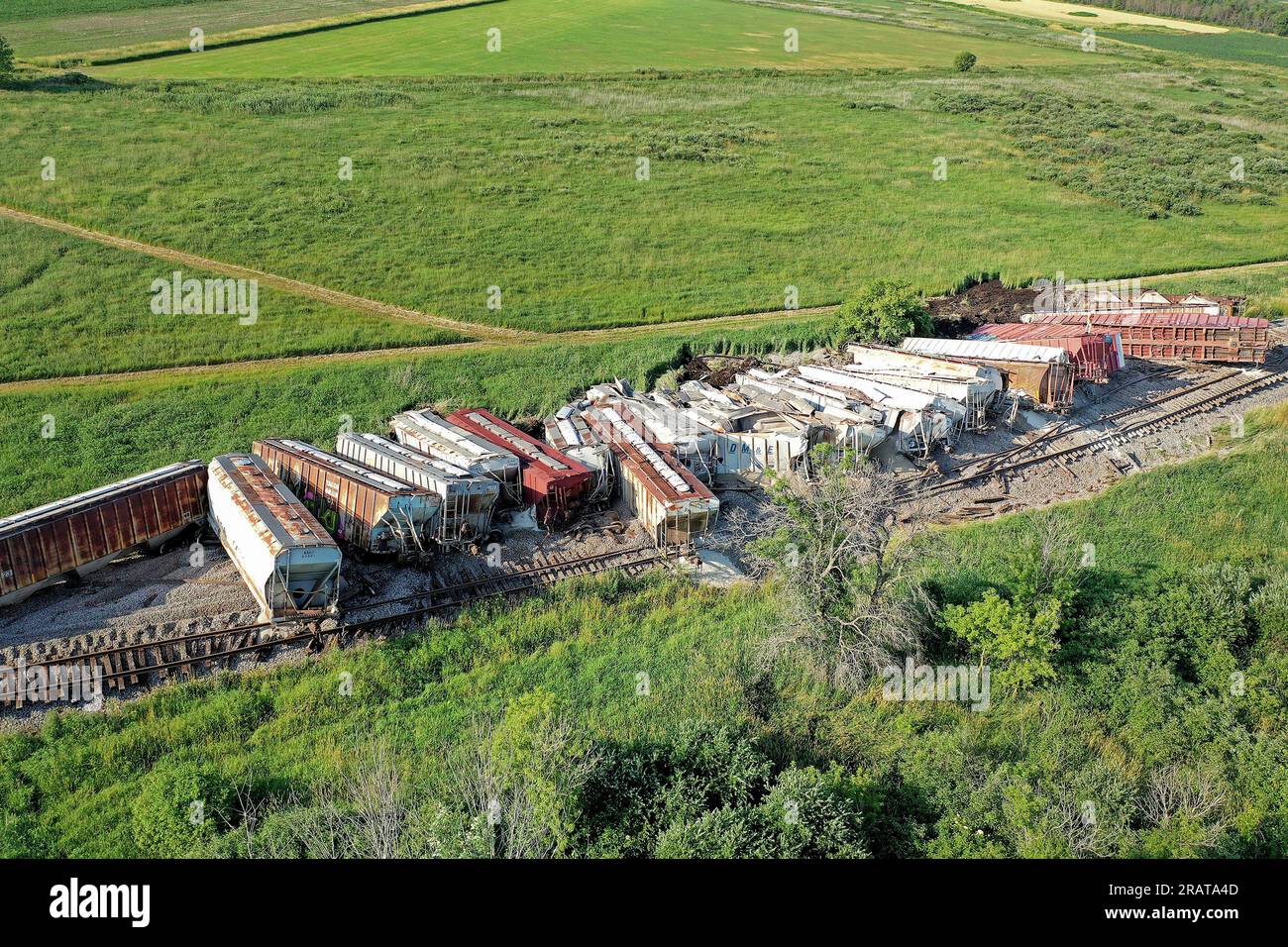 Freight cars sit damaged after a derailment in Reeseville Wis., Tuesday, July 4, 2023 ...