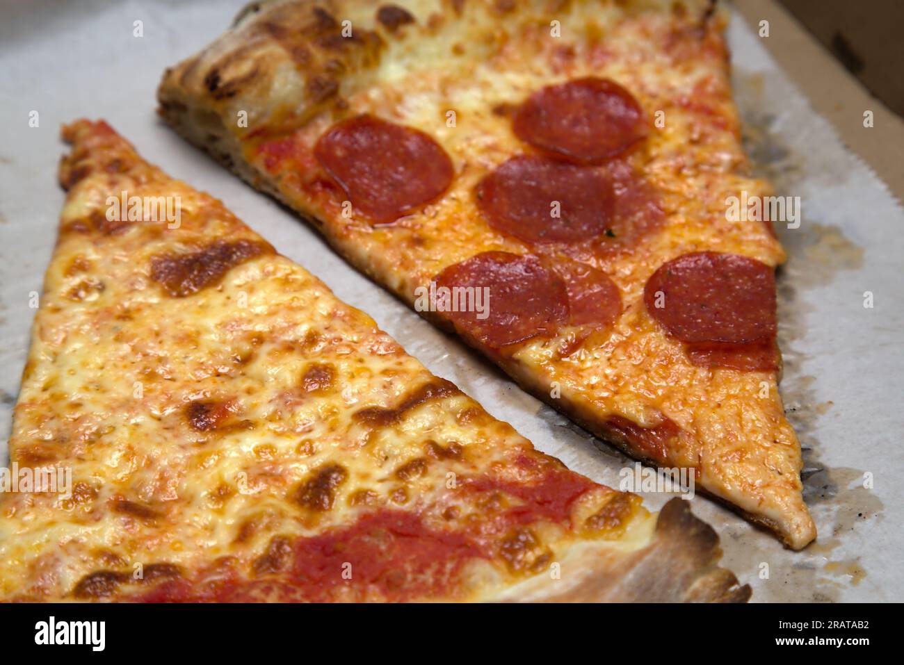 new york city style pizza slice (pepperoni, plain slice) nyc pizzeria with crushed red pepper ...