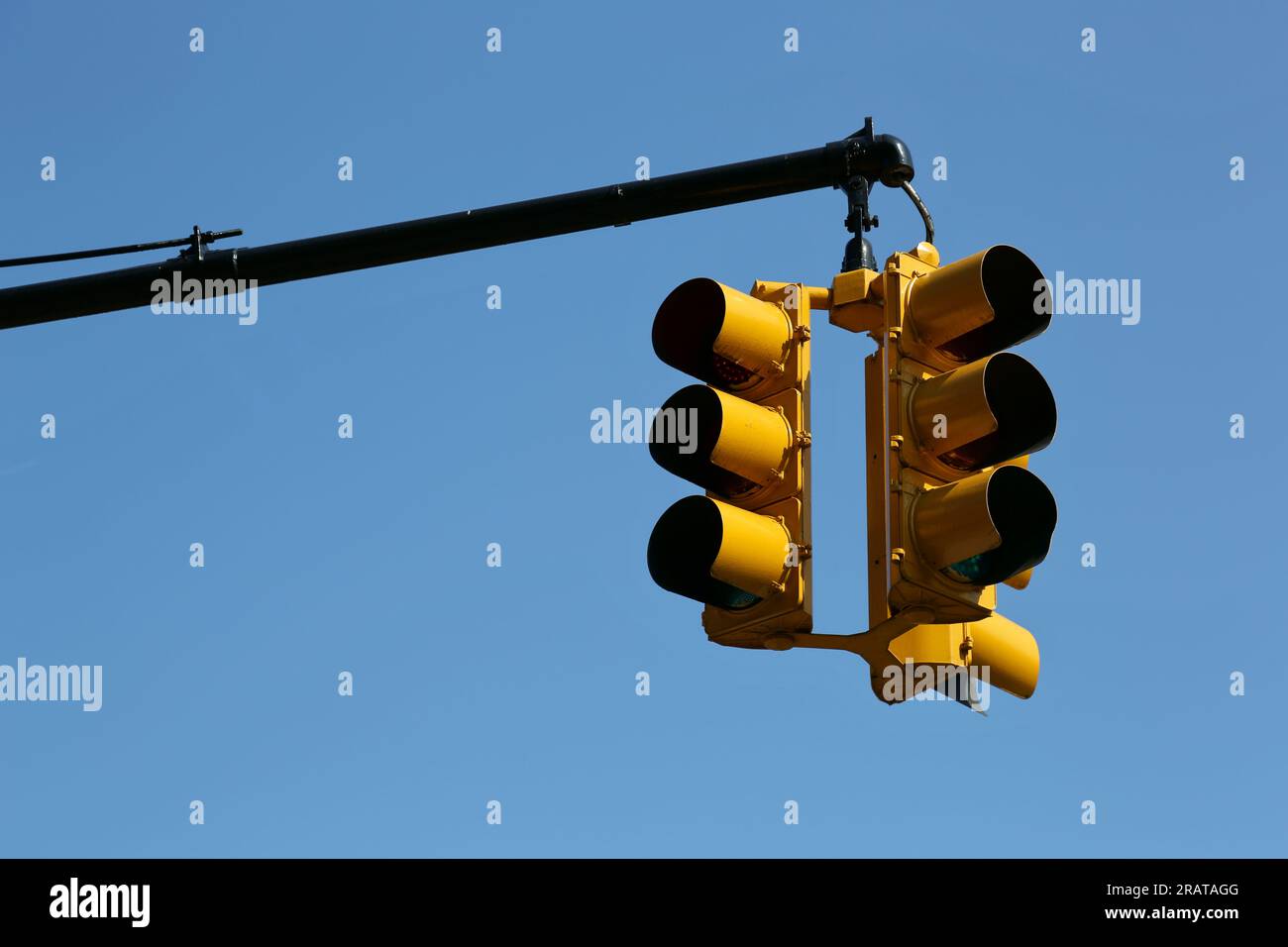 traffic light on light post (lamp post) with blue sky background (macro ...
