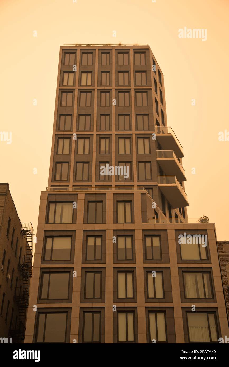 apartment building in haze from forest fires in canada (smog, smoke ...