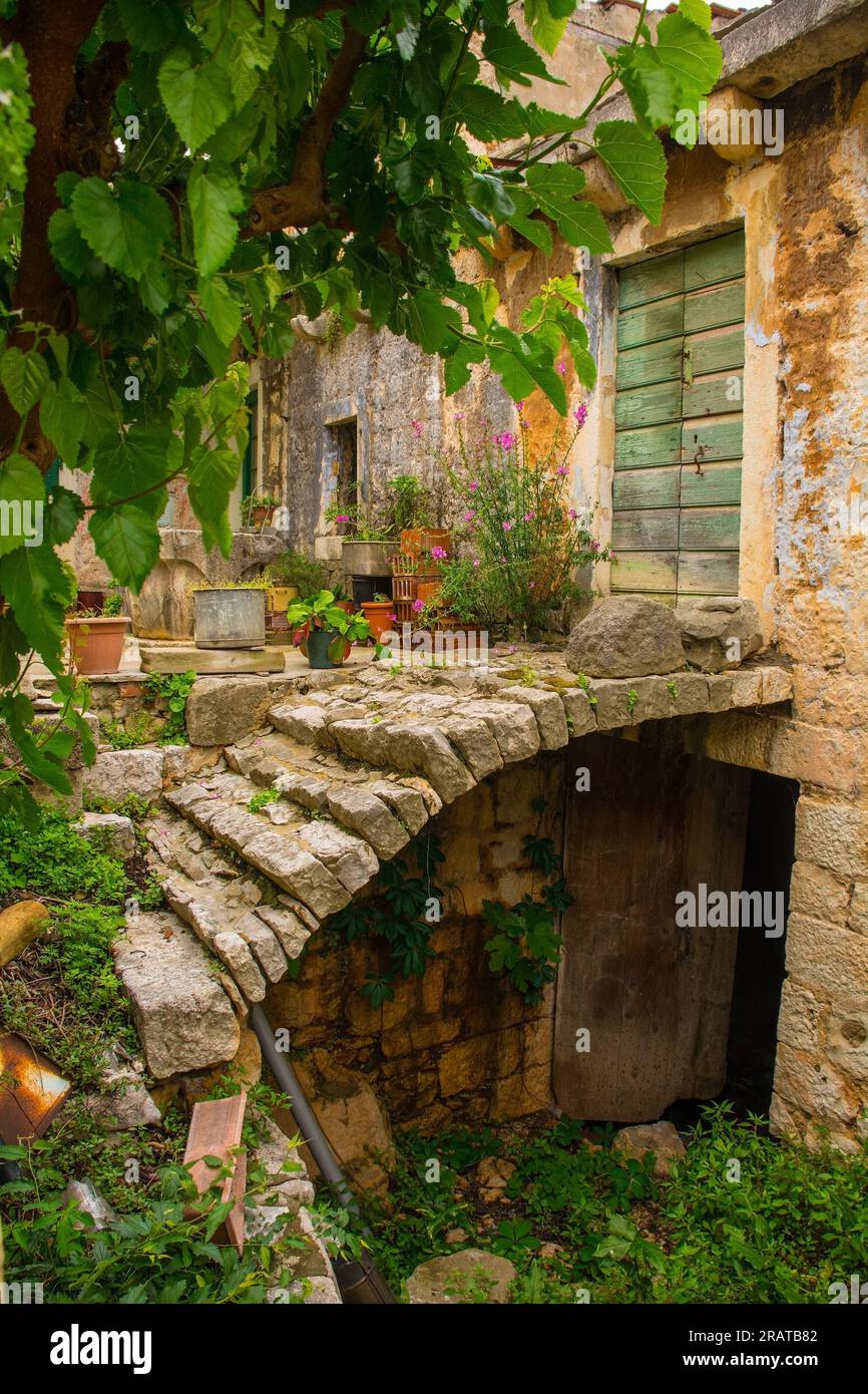 A derelict house in the village of Loziscz on Brac Island in Croatia ...