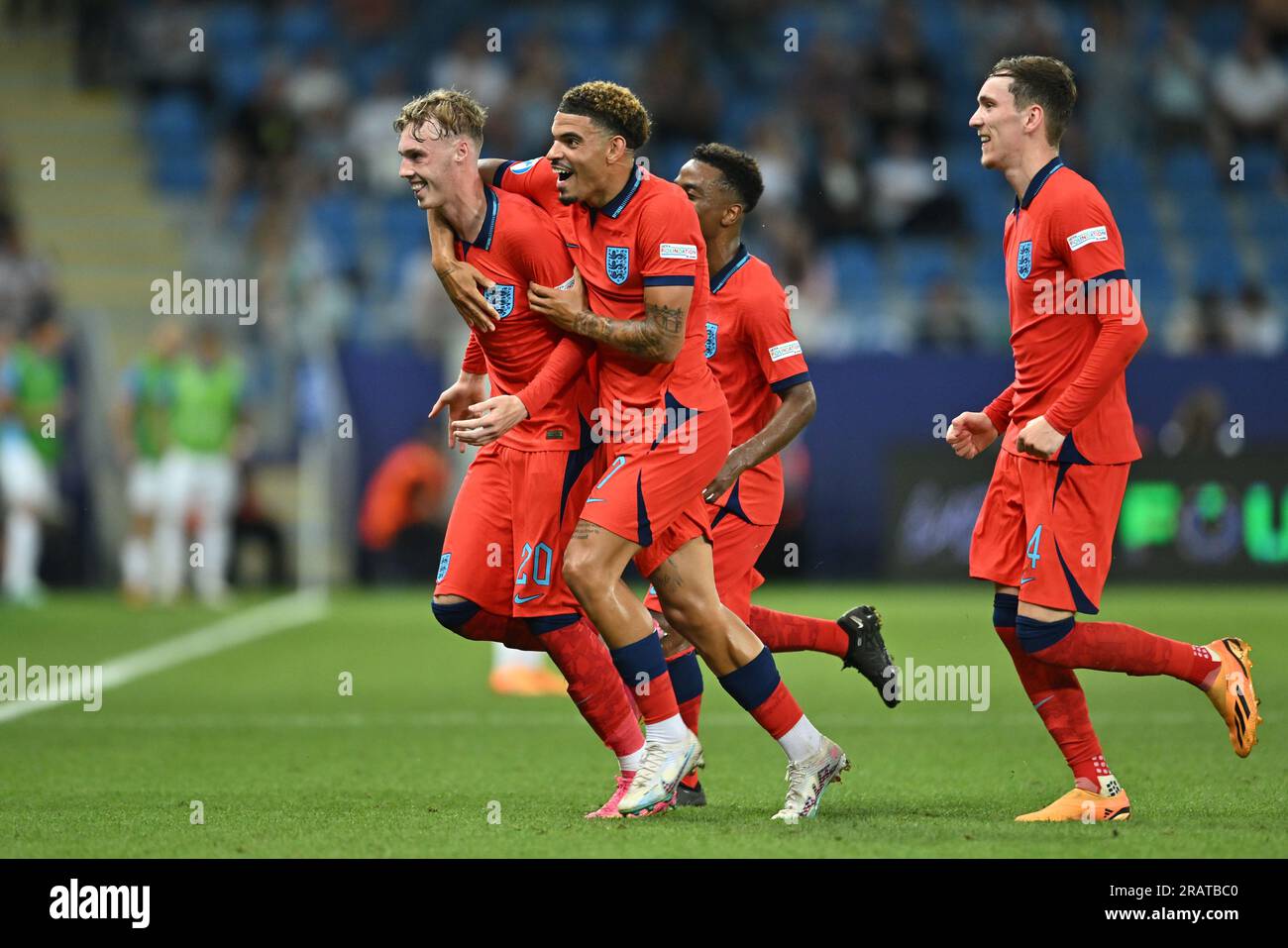 Cole Palmer of England is swamped by his team-mates after VAR awards ...