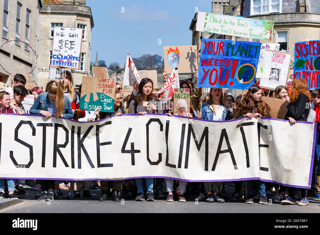 Bath college students and school kids carrying climate change placards ...