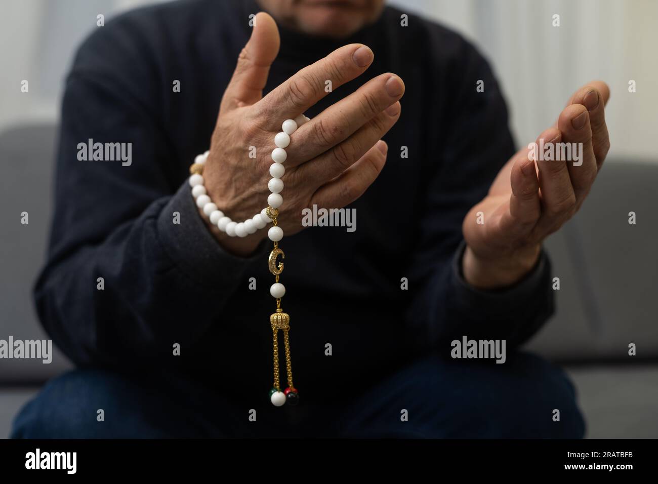 Praying hands old man rosary hi-res stock photography and images - Alamy