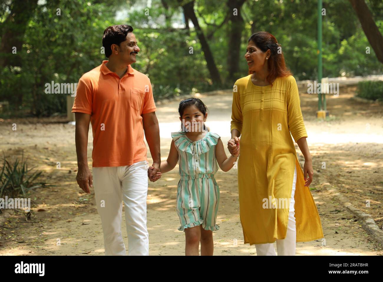 Happy Indian family with a girl child playing together and enjoying ...