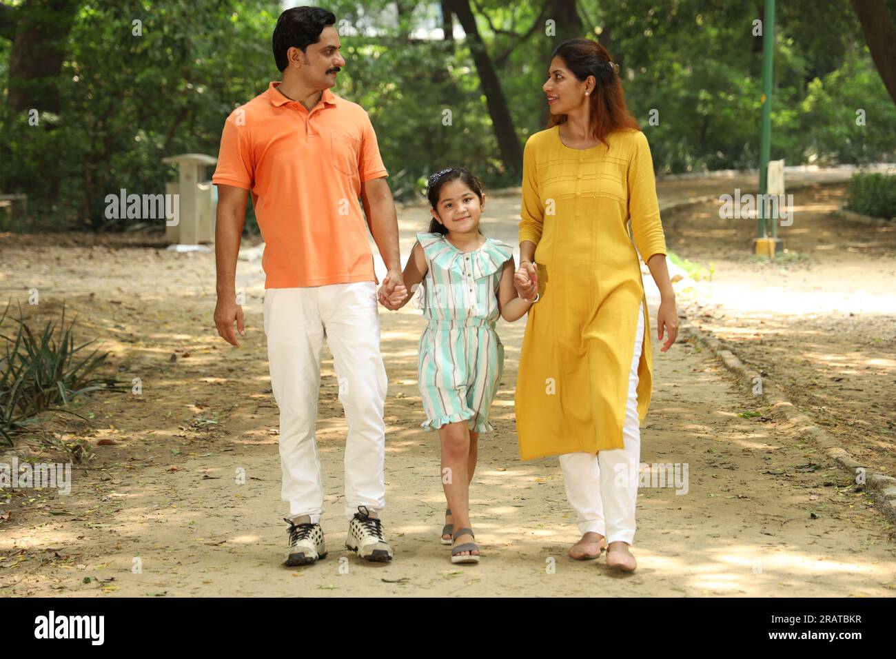 Happy Indian family with a girl child playing together and enjoying ...