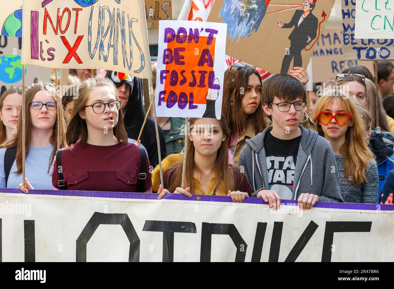 Bath college students and school kids carrying climate change placards ...