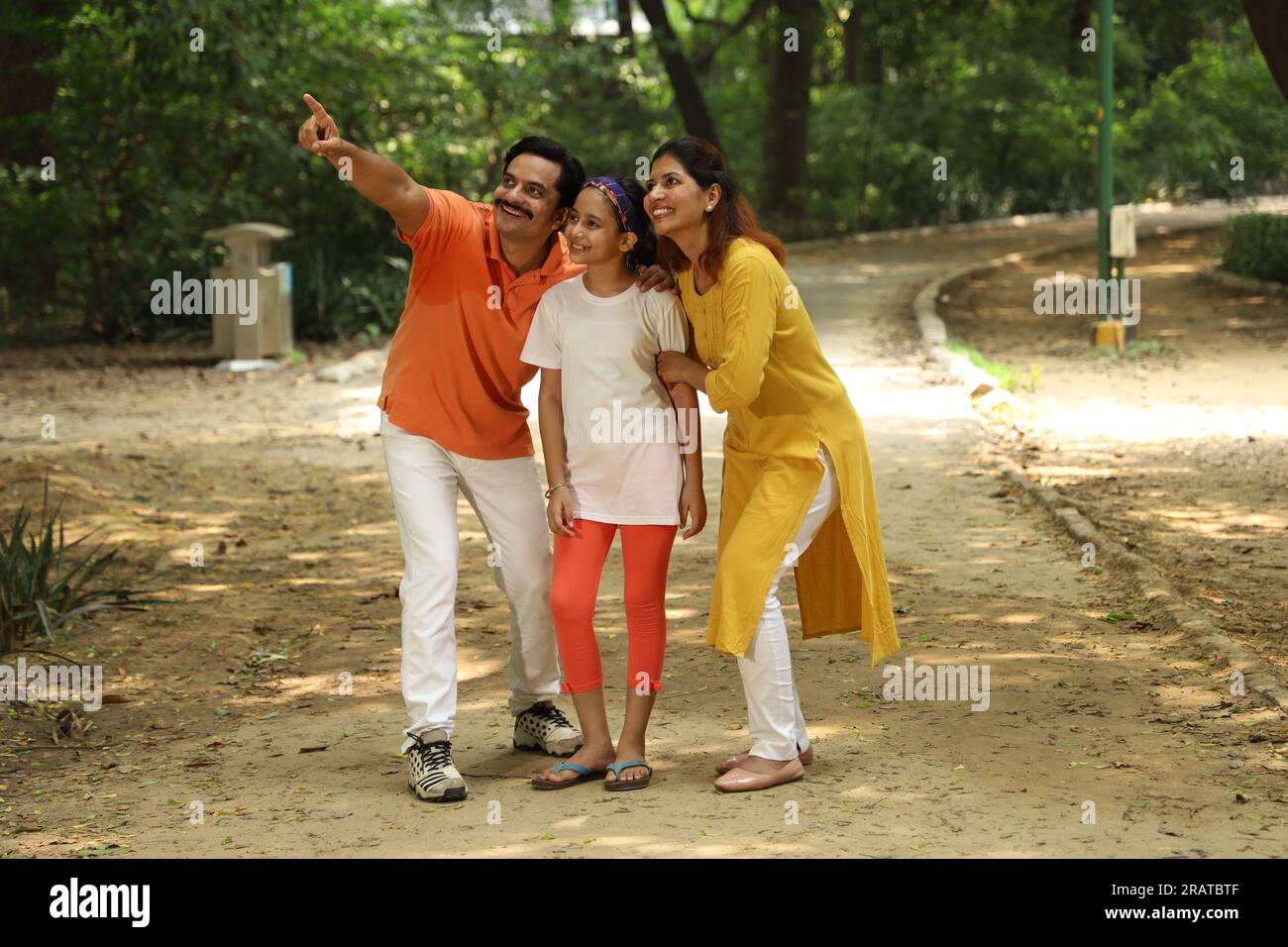 Happy Indian family with a girl child playing together and enjoying ...