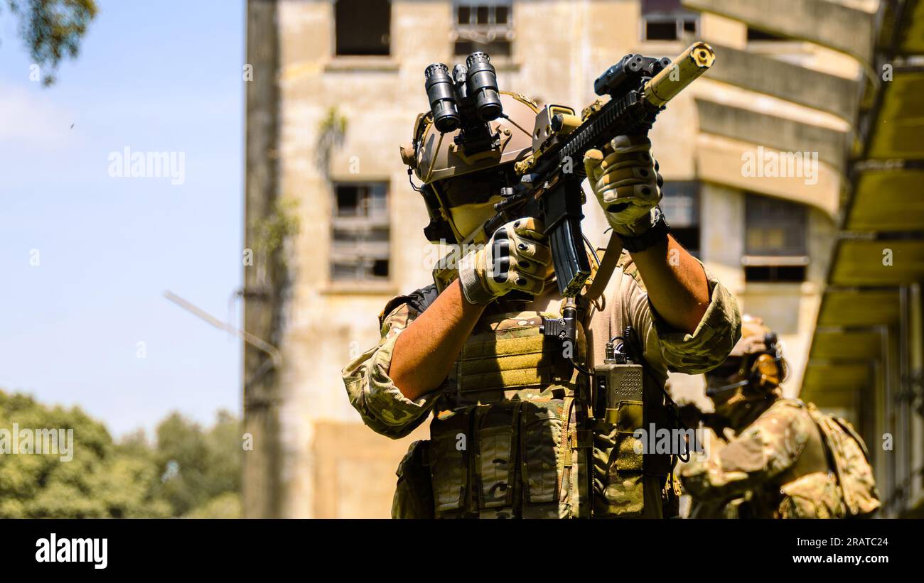 Army soldier in protective combat uniform, Soldier with rifle in forest ...
