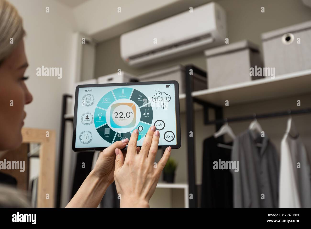 Iot Smart Home Concept - rear view of woman ask digital tablet to set ...