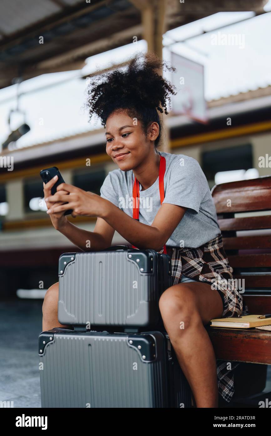 Asian teenage girl african american traveling using smartphone moblie ...