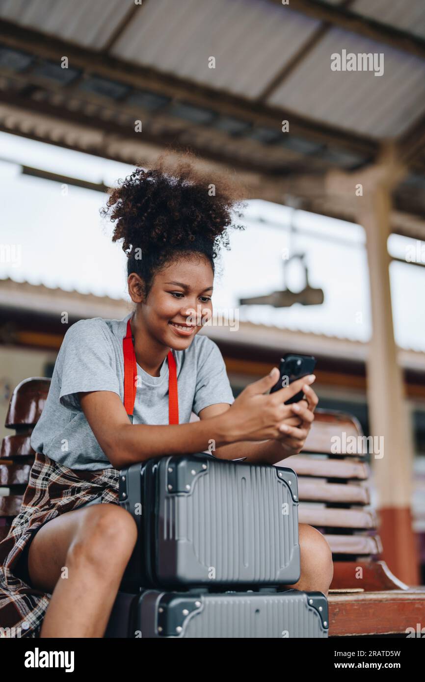 Asian teenage girl african american traveling using smartphone moblie ...
