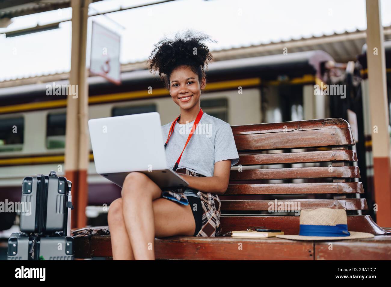 Asian teenage girl african american traveling using computer laptop ...