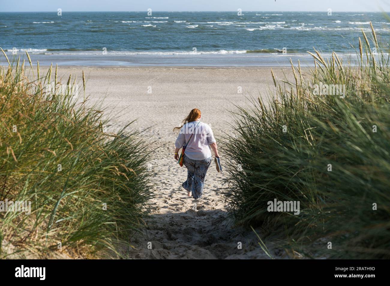 Woman footsteps in sand walking hi-res stock photography and images - Alamy