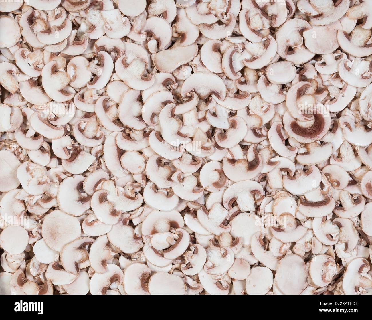 Thinly Sliced White Mushrooms 4-10-16 overhead only Stock Photo - Alamy