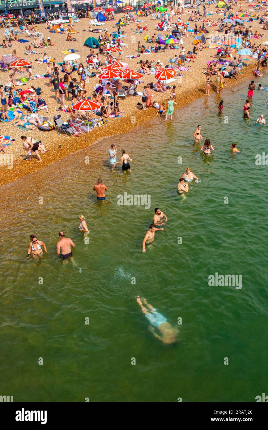 A very crowded beach on a hot summer's day in Brighton, East Sussex ...