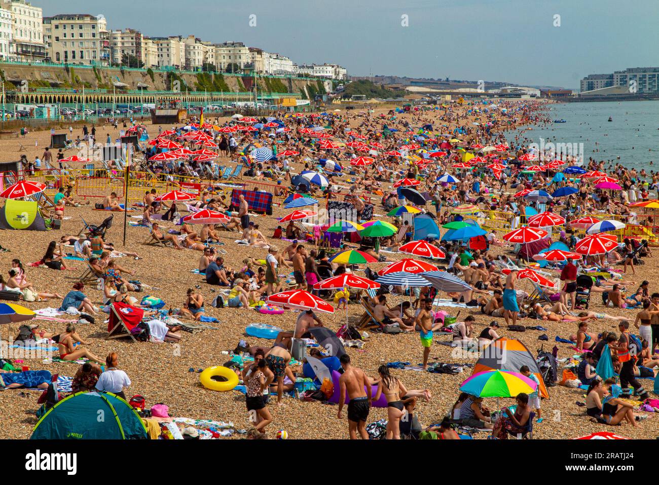 A very crowded beach on a hot summer's day in Brighton, East Sussex ...