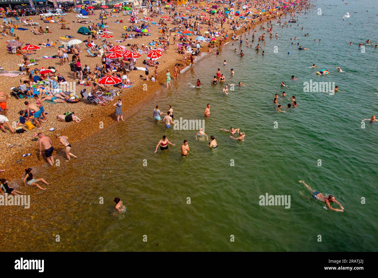 A very crowded beach on a hot summer's day in Brighton, East Sussex ...