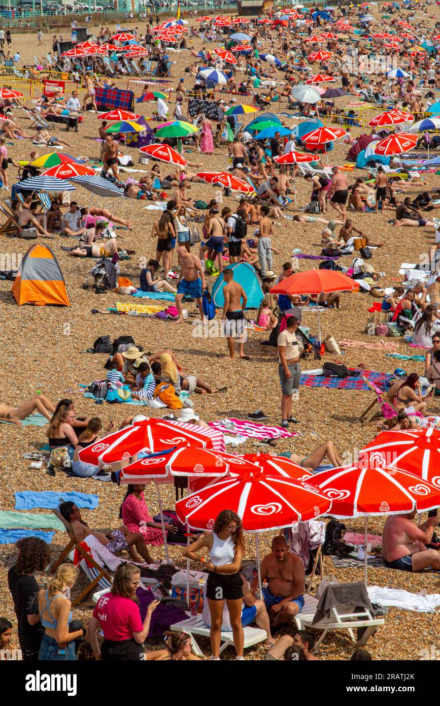 A very crowded beach on a hot summer's day in Brighton, East Sussex ...