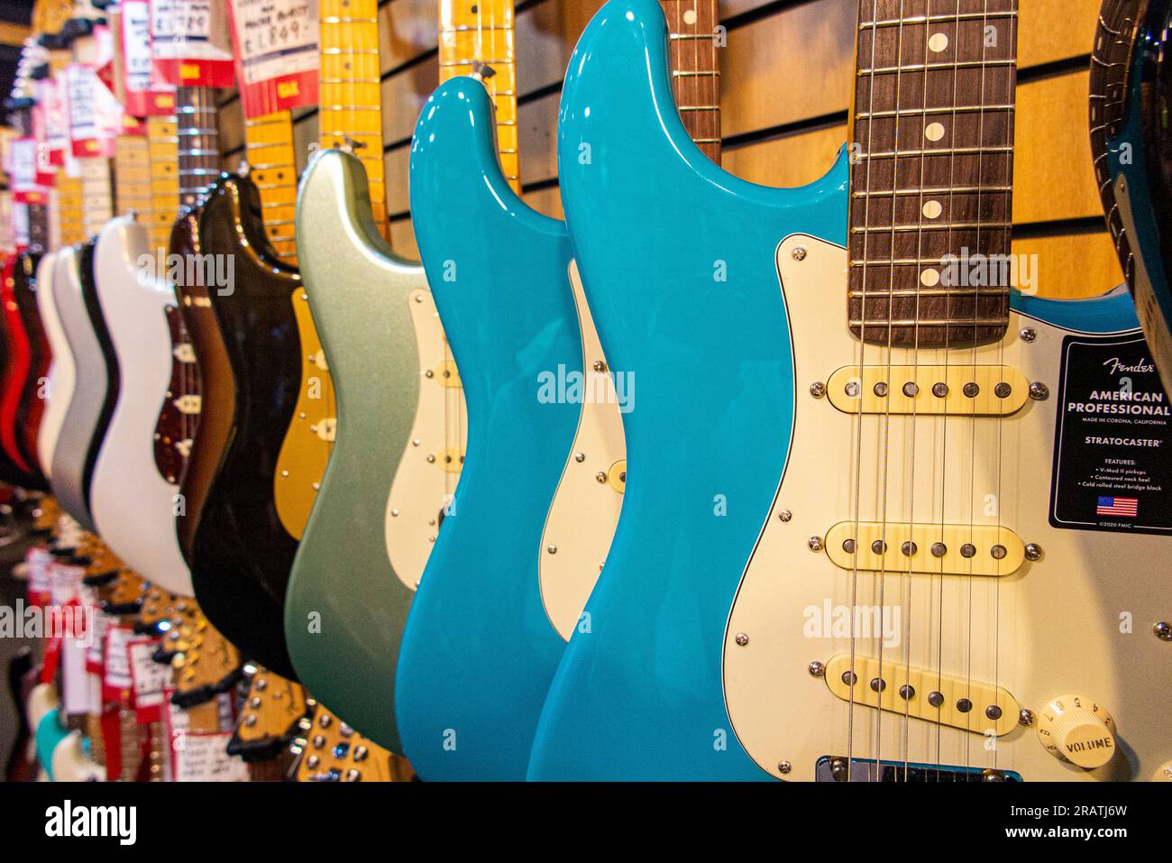 Rows of guitars in a guitar shop Stock Photo - Alamy