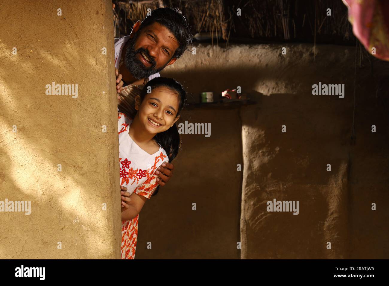 Happy Indian father and daughter playing hide and seek. Single father ...