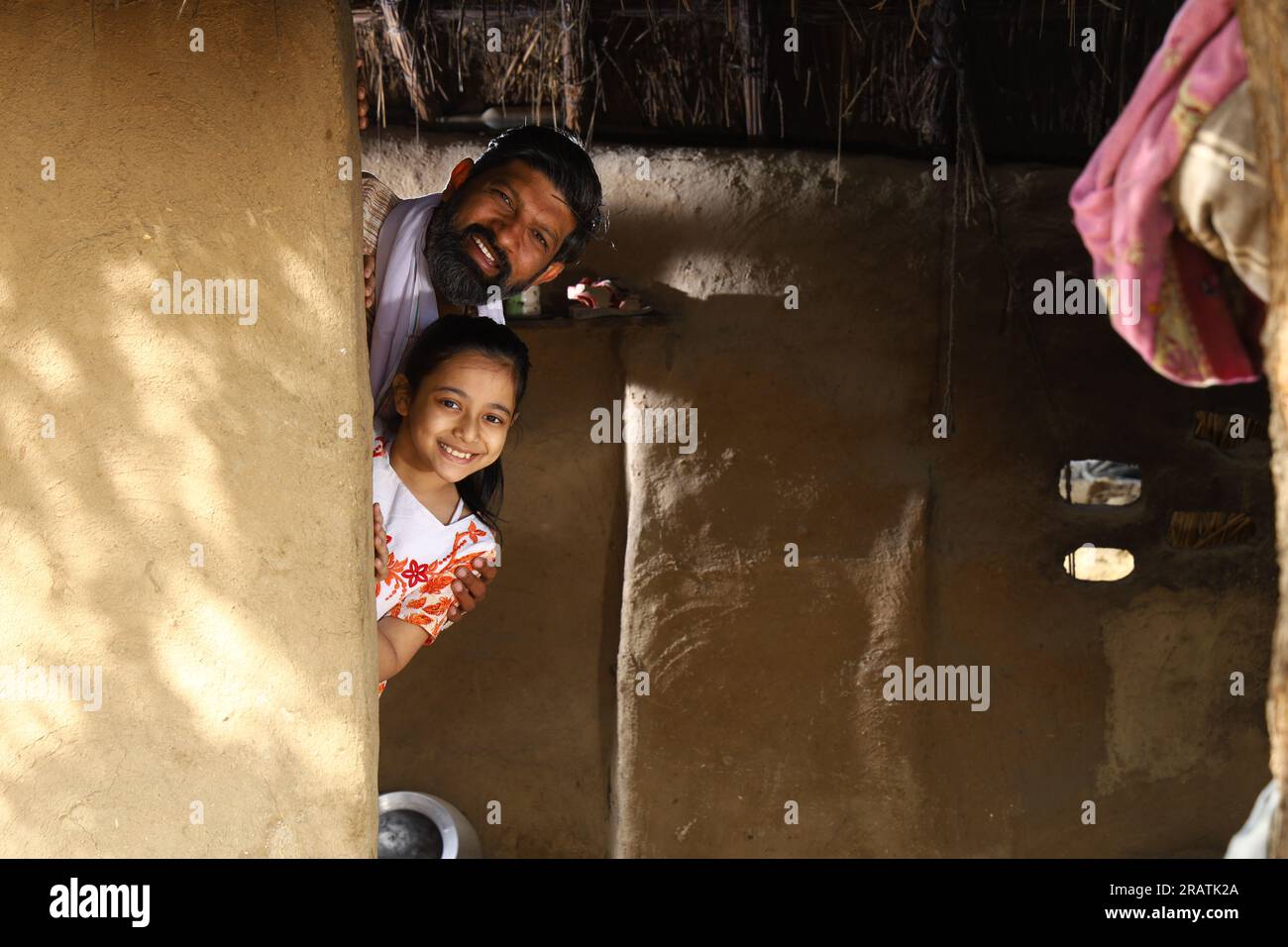 Happy Indian father and daughter playing hide and seek. Single father ...