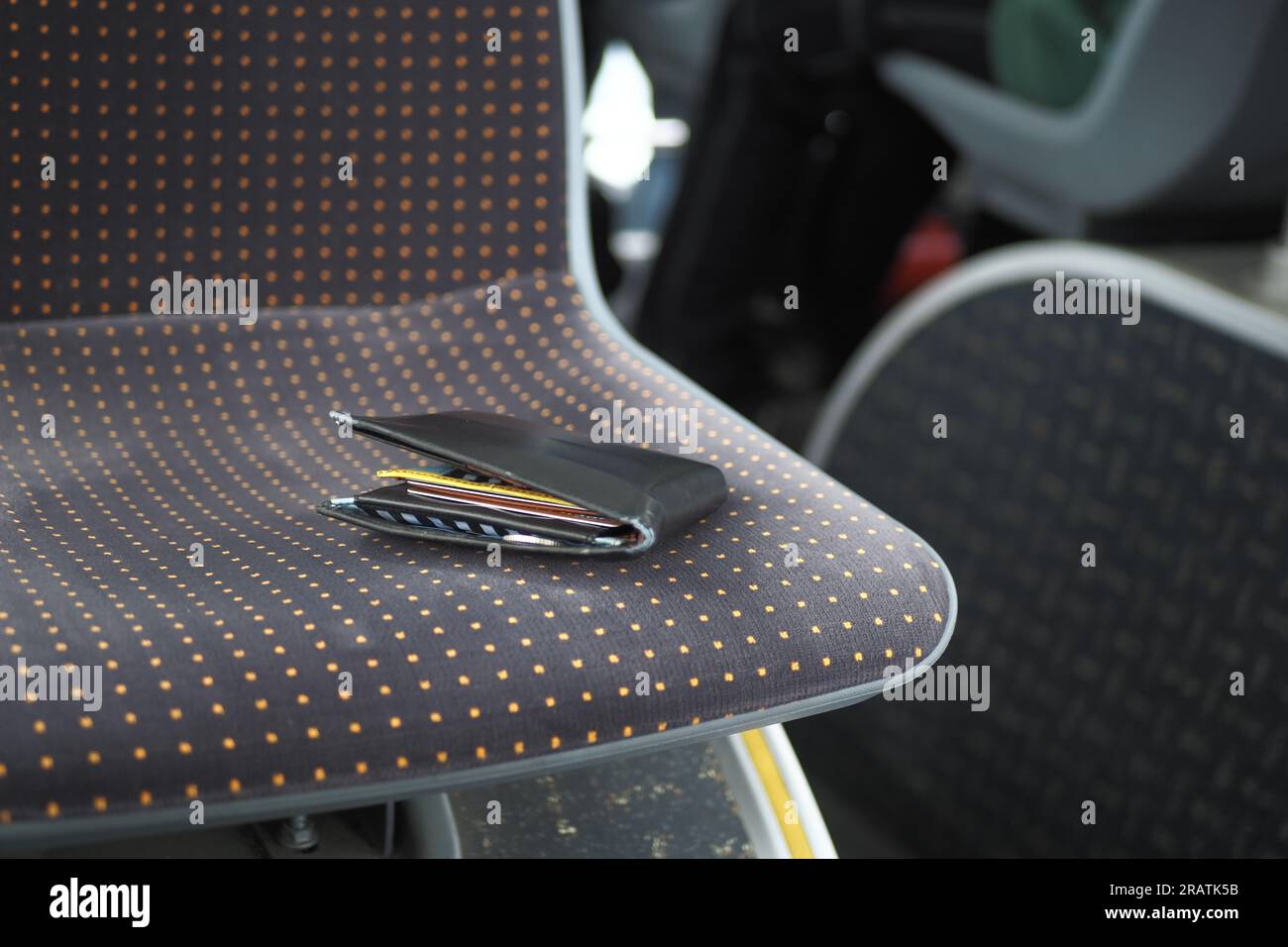 left wallet on a public bus seat Stock Photo - Alamy