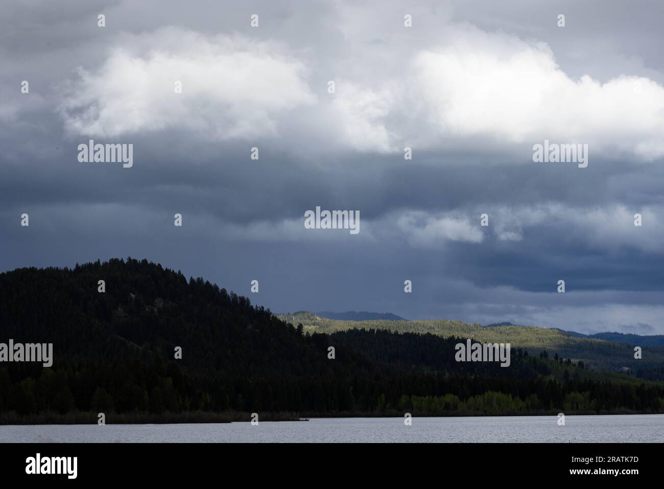 Storm clouds and weather building over Two Ocean Lake and the lower ...