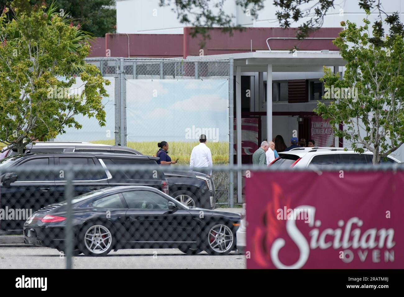 People walk near an entrance to Marjory Stoneman Douglas High School as ...