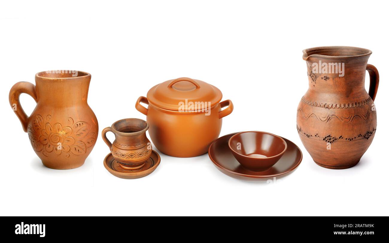 A set of dishes made of clay isolated on a white background. Wide photo ...