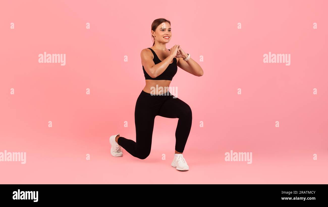 Sporty young woman making lunge hi-res stock photography and images - Alamy