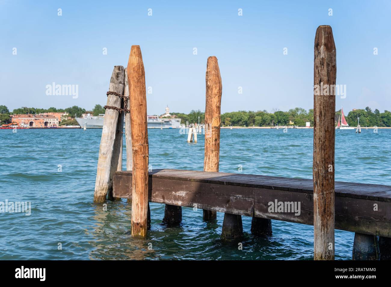 A wooden mooring pier and mooring piles on the Grand Canal in Venice ...