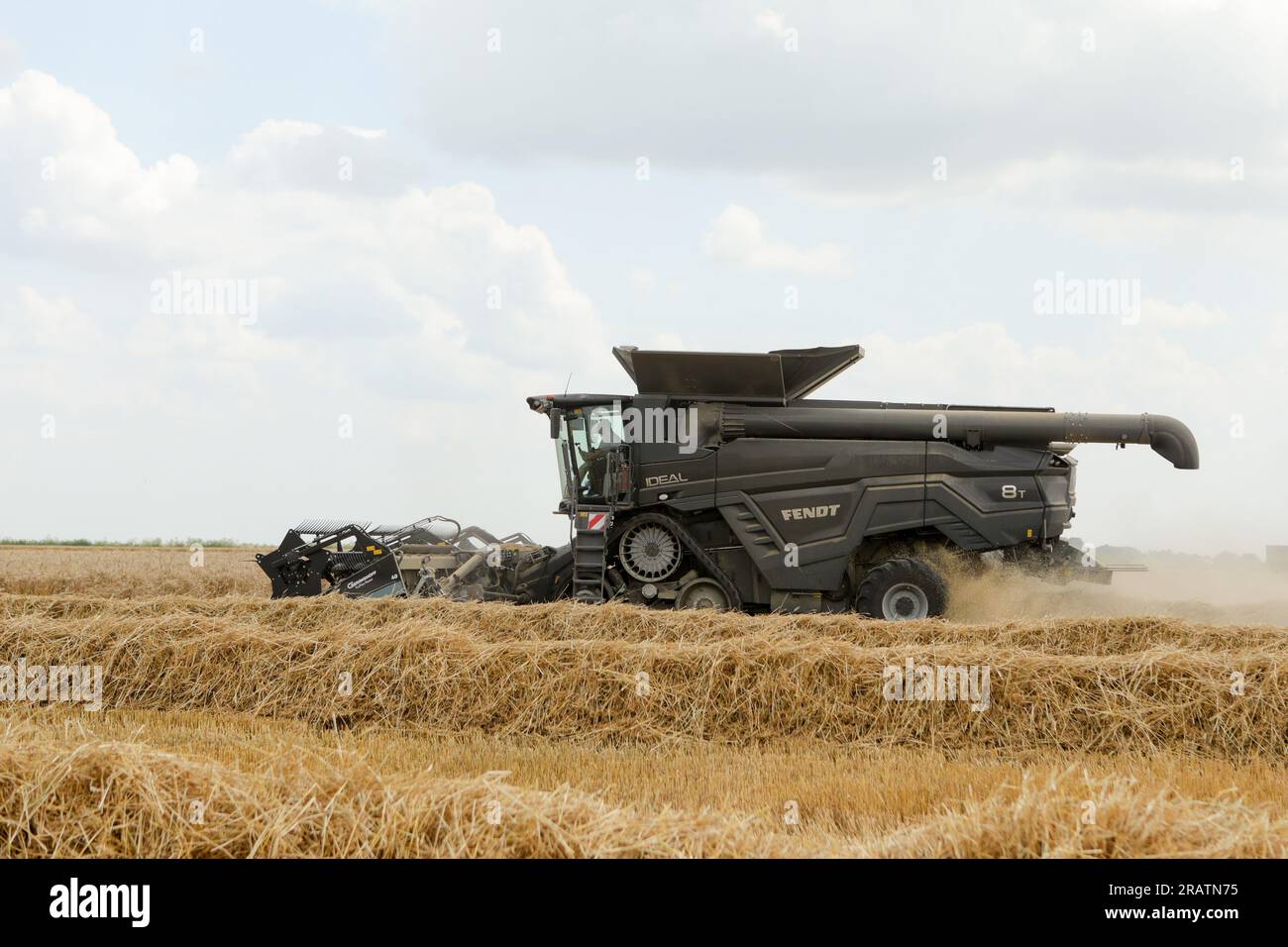 Combine harvester Fendt Ideal 8T during harvest on the arable land of ...