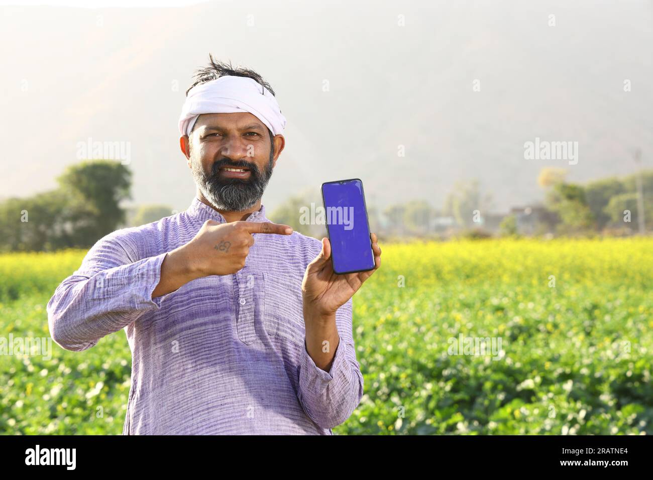 Happy Indian Farmer With Mobile