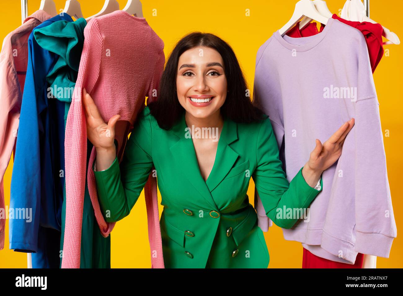 Sales and discounts. Satisfied smiling shopaholic woman peeking out ...