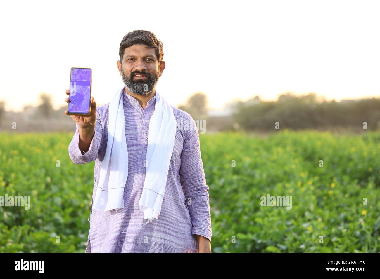 Happy Indian Farmer With Mobile