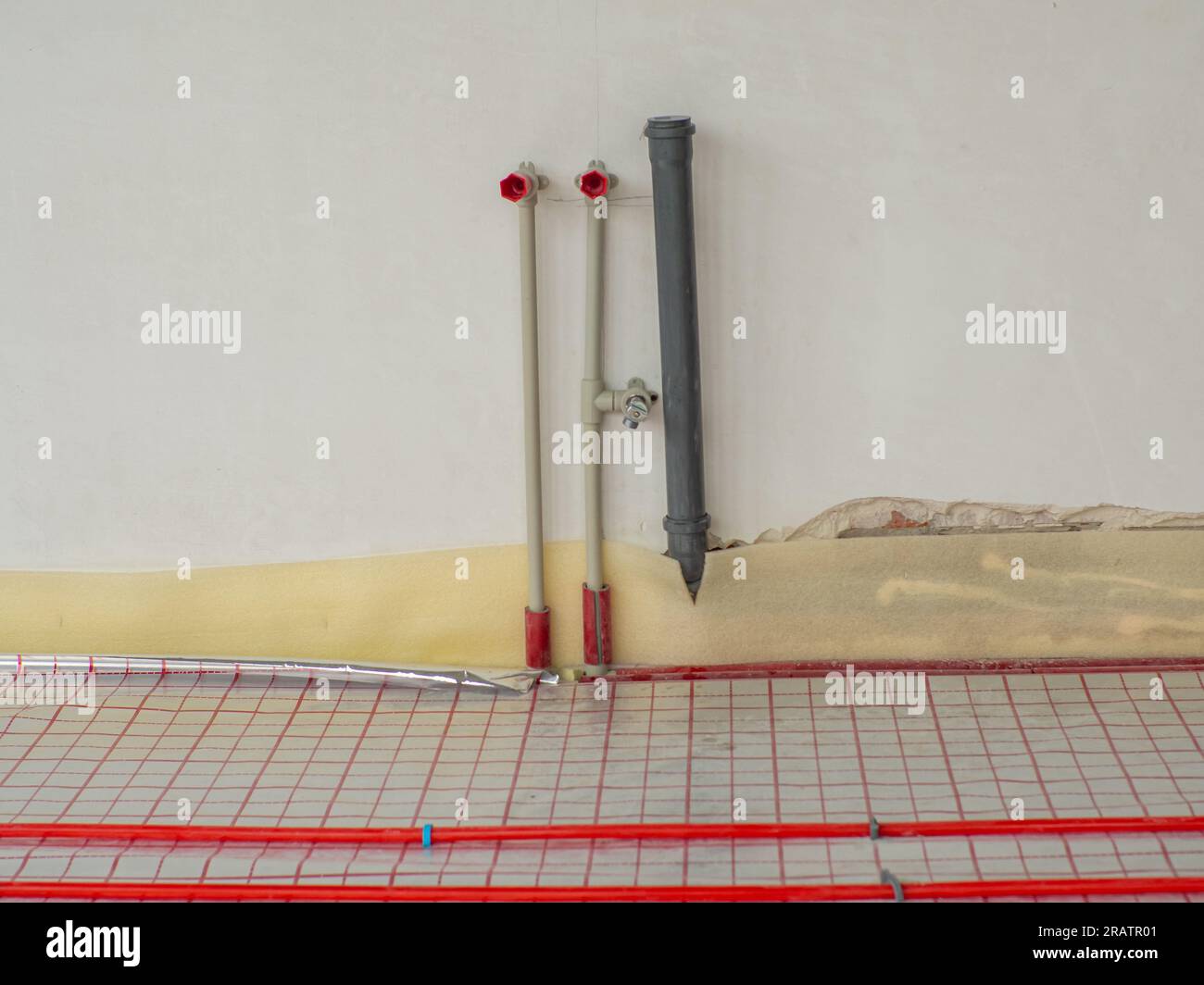 Installing heating and water pipes in apartment Stock Photo - Alamy