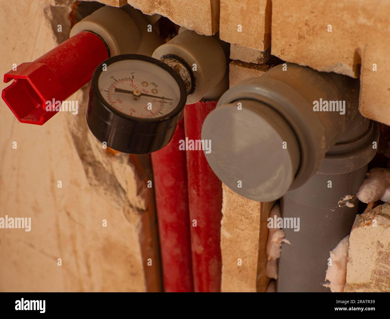 Installing heating and water pipes in apartment Stock Photo - Alamy