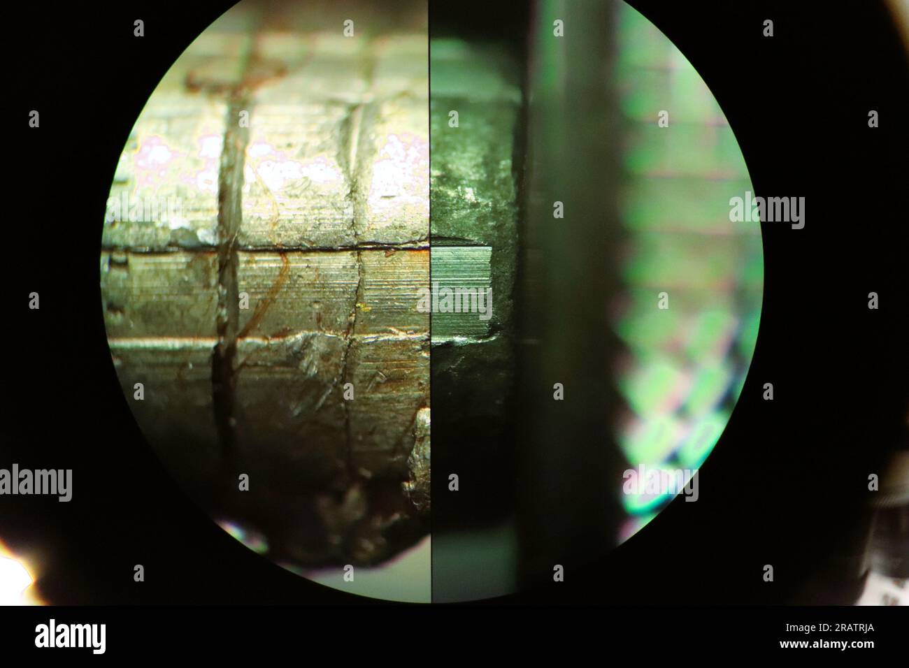 Bullet comparison through microscope Stock Photo - Alamy