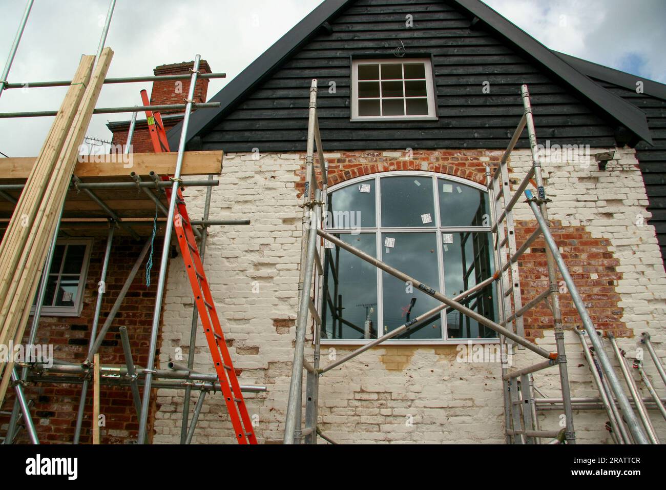 A new window and brickwork as a the stables at a Suffolk hotel is ...