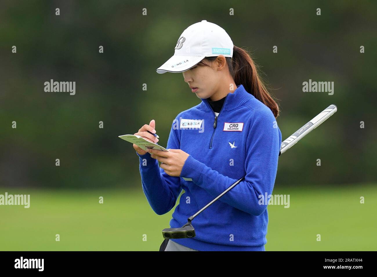 Saki Baba, of Japan, takes notes on the sixth green during a practice ...