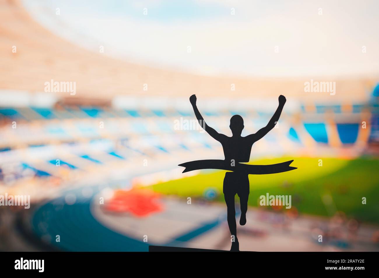 Exhilarating Finish: Silhouetted Runner Claims Victory at Modern ...