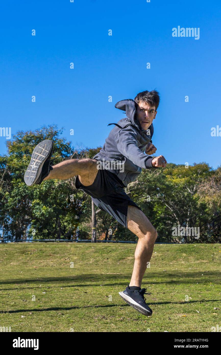Martial fighter practicing flying kicks. Copy space Stock Photo - Alamy