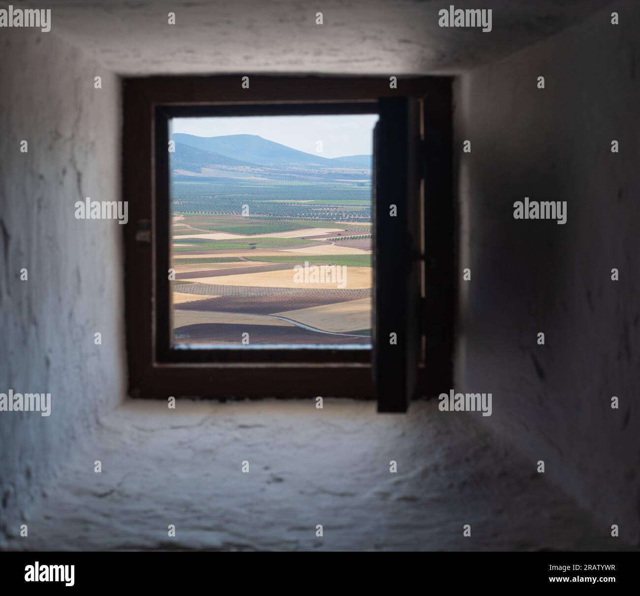 Crop fields of Castilla-La Mancha (Spain) seen through a square wooden ...